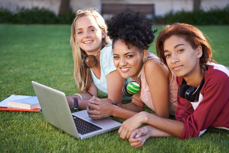 Group Study Session. Portrait of Three Smiling Friends Lying in a Park ...