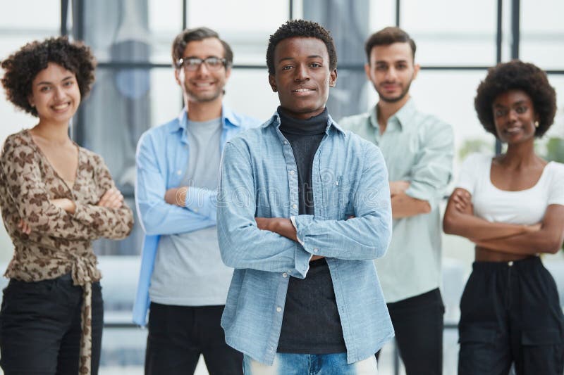 A Group of Successful Business Diverse People in the Office Stands ...