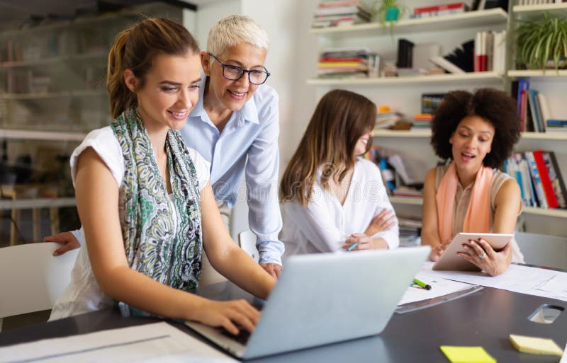 Group of Successful Business Women Working Together in Office. Business ... Group of Successful Business Women Working Together in Office. Business ...