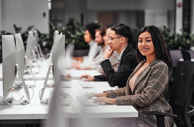 Group of Successful Smiling Business People Working on Computers ...
