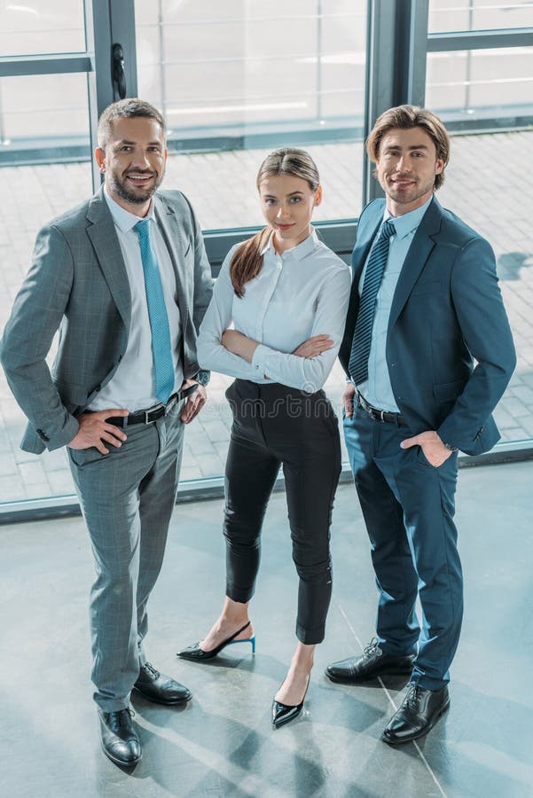 Group of Successful Young Business People Standing at Modern Office and ...