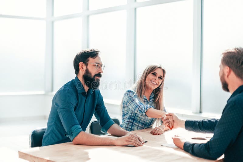 Group of Successful Young People Sitting at the Negotiating Table ...