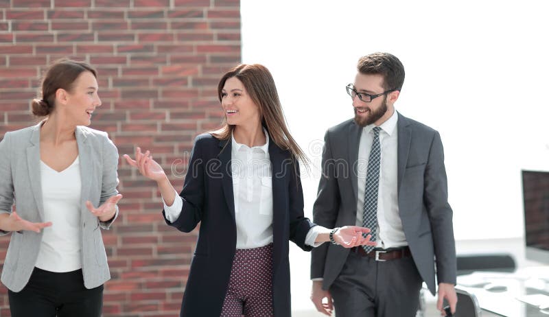 Group of Successful Young People Talking in the Office. Stock Photo ...