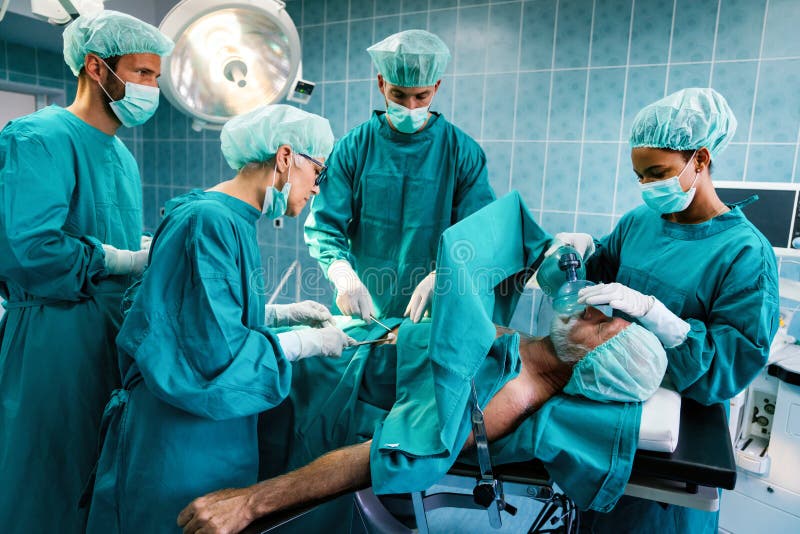 Group of Surgeon Doctor Team at Work in Operating Room. Stock Image ...
