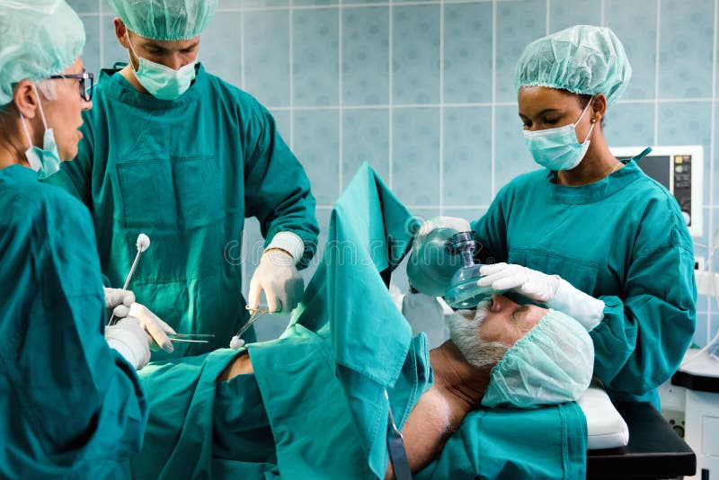 Group of Surgeon Doctor Team at Work in Operating Room. Stock Photo ... Group of Surgeon Doctor Team at Work in Operating Room. Stock Photo ...