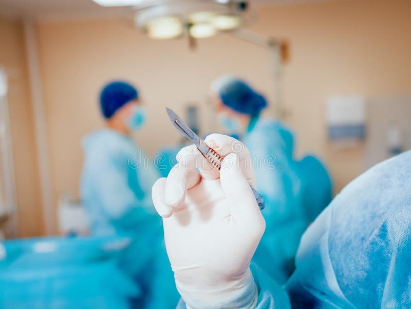 Group of Surgeons in Operating Room with Surgery Equipment. Stock Image ...