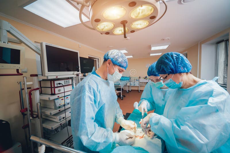 Group of Surgeons in Operating Room with Surgery Equipment. Stock Photo ...