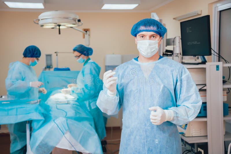 Group of Surgeons in Operating Room with Surgery Equipment. Stock Image ...