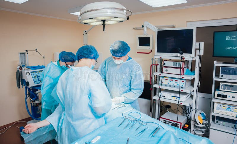 Group of Surgeons in Operating Room with Surgery Equipment. Stock Image ...