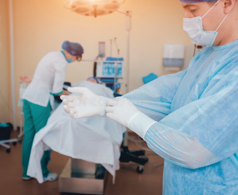 Group of Surgeons in Operating Room with Surgery Equipment. Stock Photo ... Group of Surgeons in Operating Room with Surgery Equipment. Stock Photo ...
