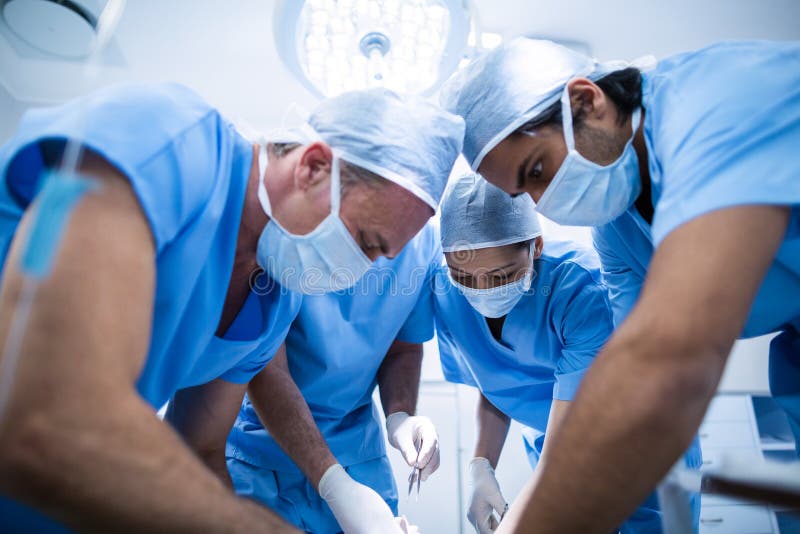Group of Surgeons Performing Operation in Operation Room Stock Photo ...