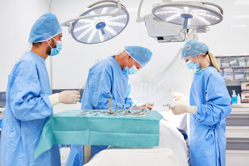 Group of Surgeons Puts on Latex Gloves Stock Image - Image of doctors ...
