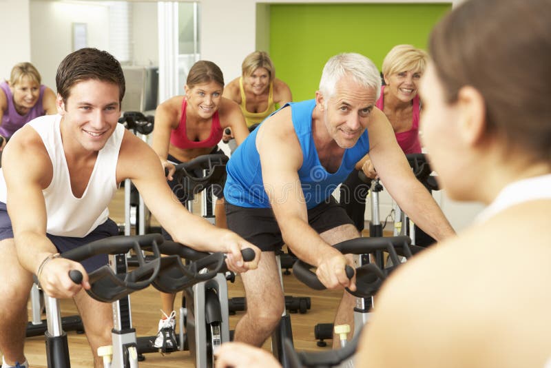 Group Taking Part in Spinning Class in Gym Stock Image - Image of ...