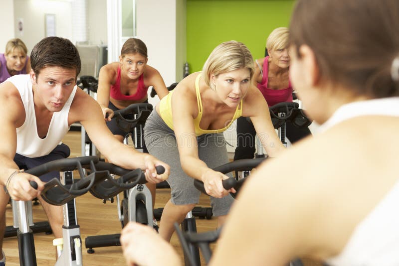 Group Taking Part in Spinning Class in Gym Stock Photo - Image of ...
