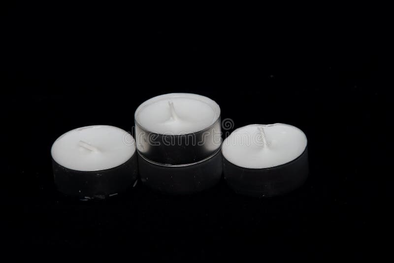 A Group of Tea Lights Isolated on Black Background Stock Image - Image ...