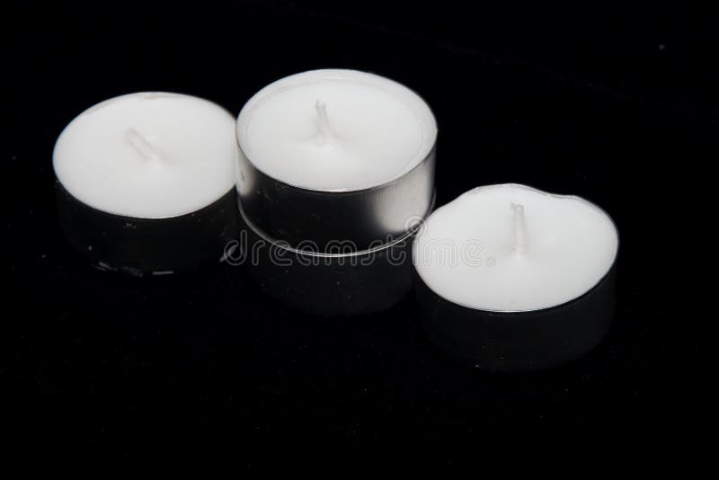 A Group of Tea Lights Isolated on Black Background Stock Photo - Image ...
