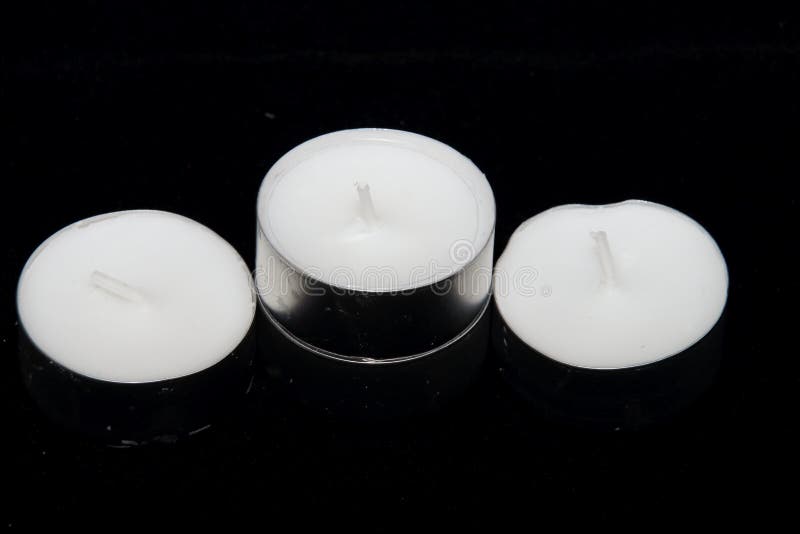 A Group of Tea Lights Isolated on Black Background Stock Photo - Image ...