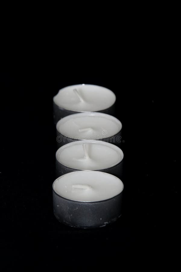 A Group of Tea Lights Isolated on Black Background Stock Image - Image ...