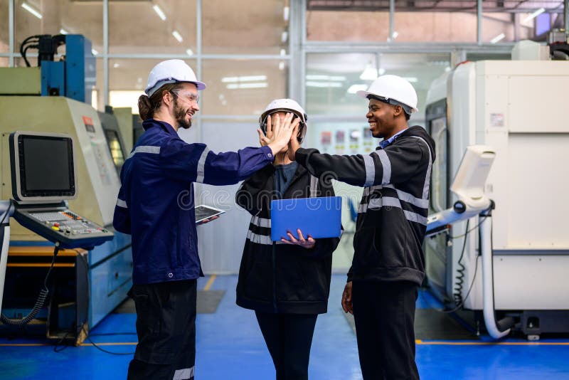 Group of Technicians Engineers Team Working at Industrial Factory Stock ...
