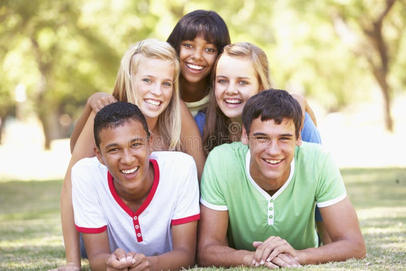 Group of Teenage Friends Having Fun in Park Stock Photo - Image of ...