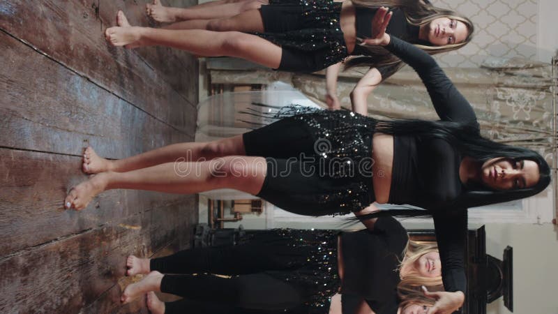 A Group of Teenage Girls Dance a Synchronized Oriental Dance with Their ... A Group of Teenage Girls Dance a Synchronized Oriental Dance with Their ...