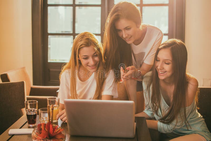Group of Teenage Girls Using Laptop in a Cafe Stock Image - Image of ...
