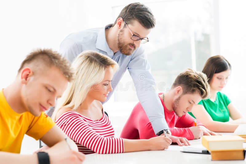 Group of Teenage Students Studying at the Lesson in the Classroom Stock ...