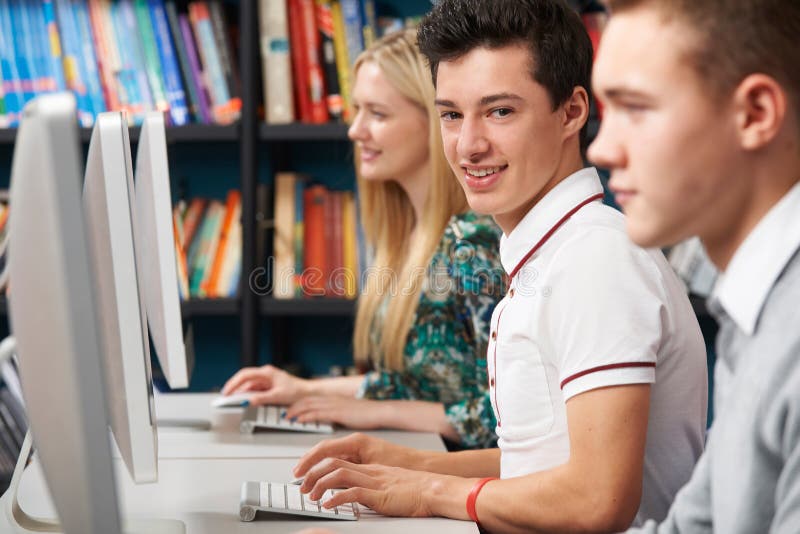 Group of Teenage Students Working at Computers in Classroom Stock Image ...