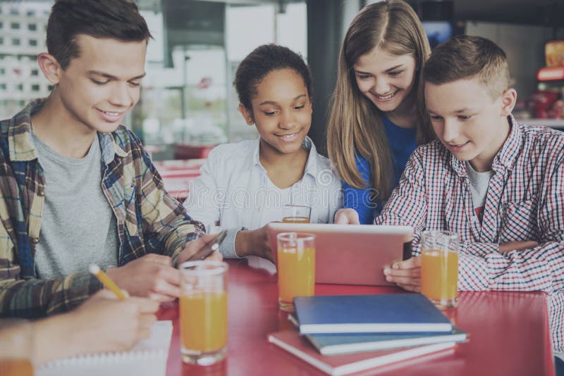 Group of Teenagers Doing Homework with Tablet. Stock Photo - Image of ...