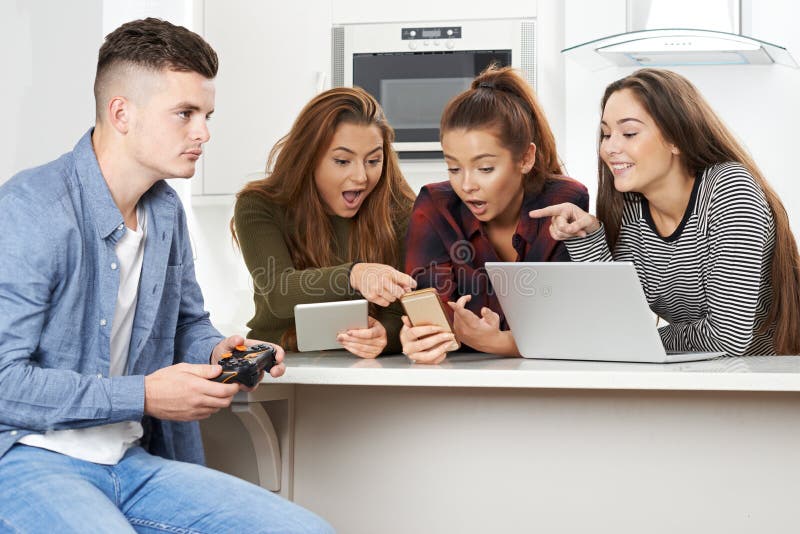 Group of Teenagers Using Digital Technology at Home Stock Photo - Image ...