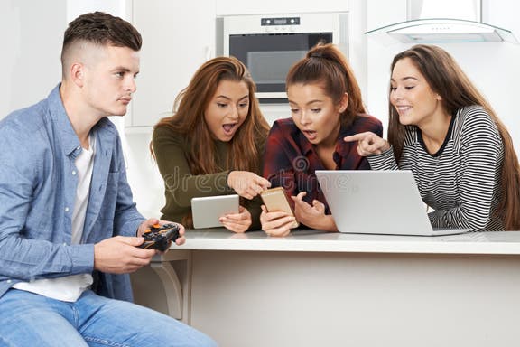 Group of Teenagers Using Digital Technology at Home Stock Photo - Image ...
