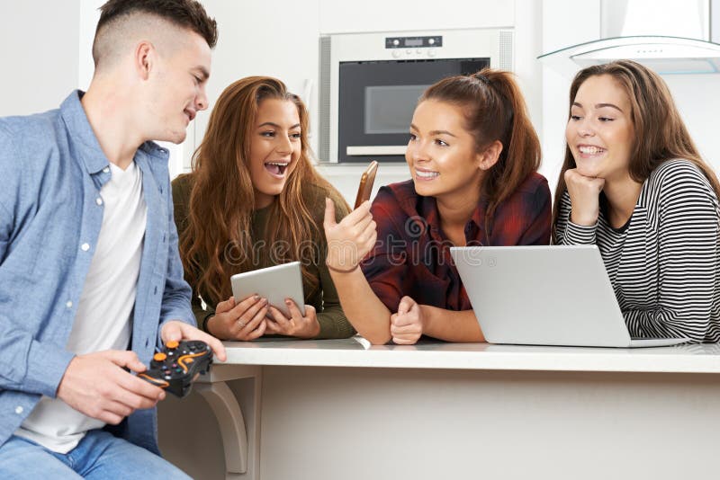 Group of Teenagers Using Digital Technology at Home Stock Photo - Image ...