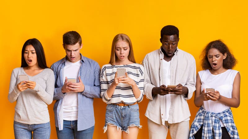 Group of Teenagers Using Mobile Phones Over Yellow Background Stock ...