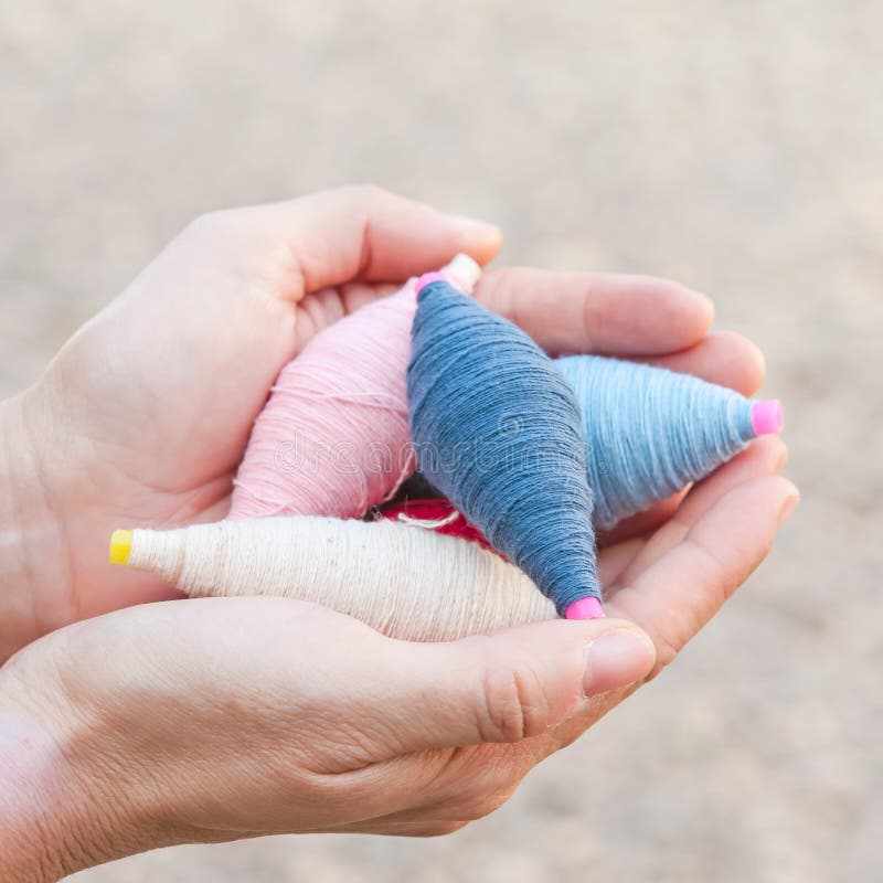 Group of thread on hand stock image. Image of textile - 36286559