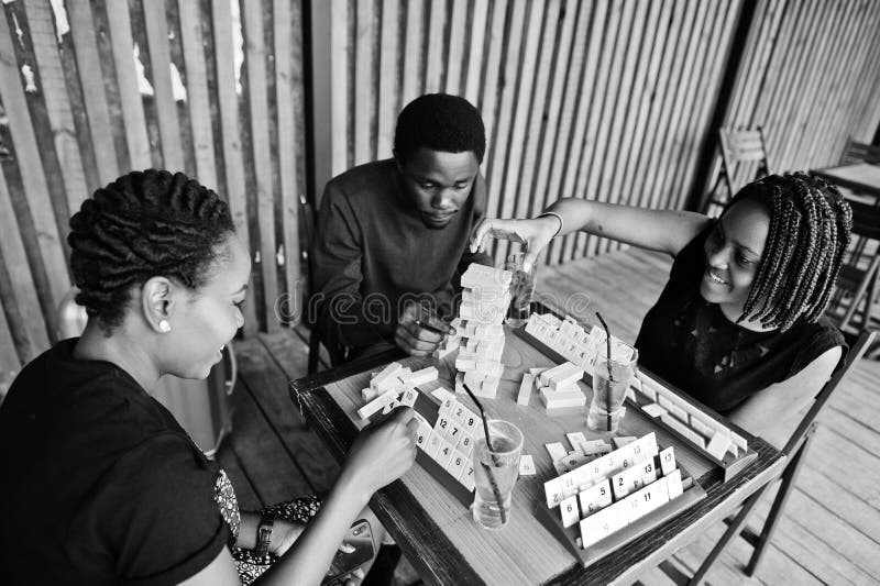 Group of Three African American Friends Play Table Games Stock Photo ...