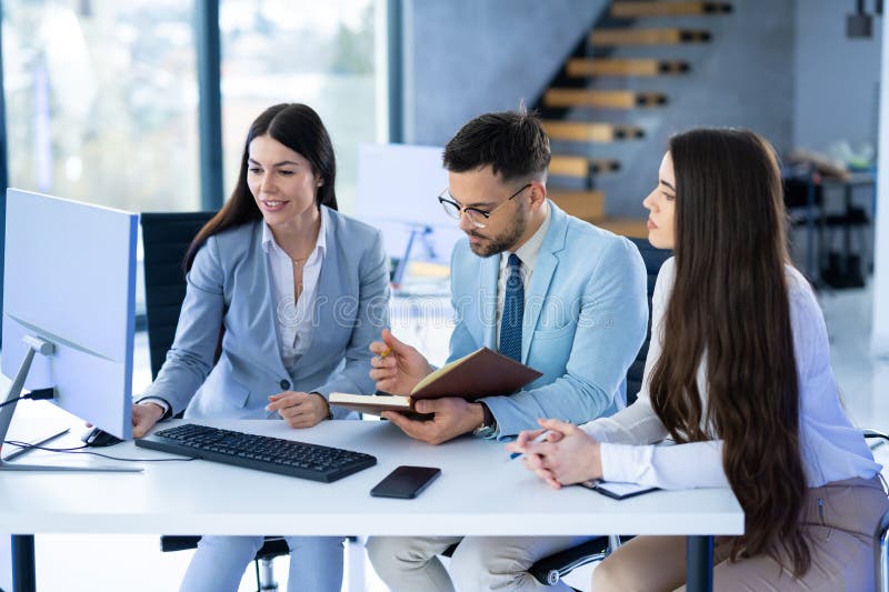 Group of Three Business People Working Together in the Office. Stock ...