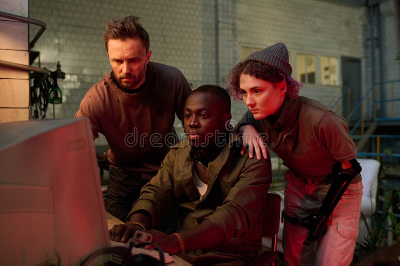 Three Scientists Using Old Computer in Abandoned Building Stock Image ...