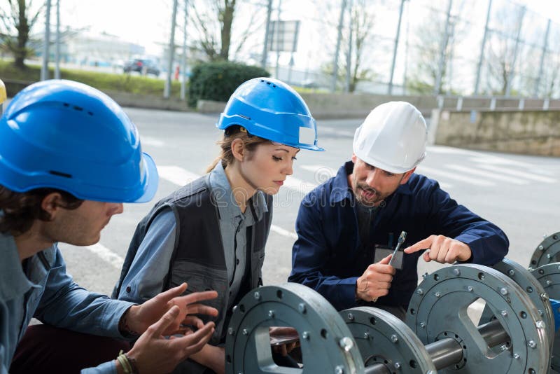 Three Engineers Work with a 3d Printer in a Modern Laboratory. they ...