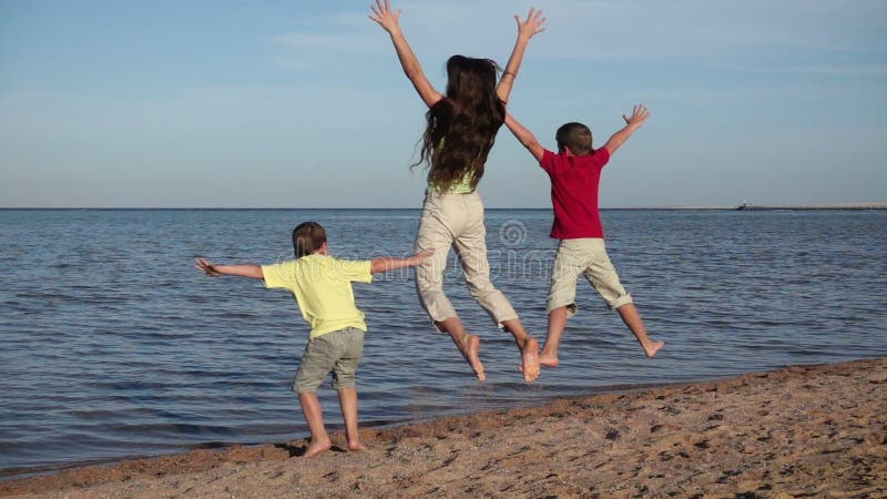 Group of Three Kids Jumping at the Beach in Egypt Resort, Slow M Stock ...
