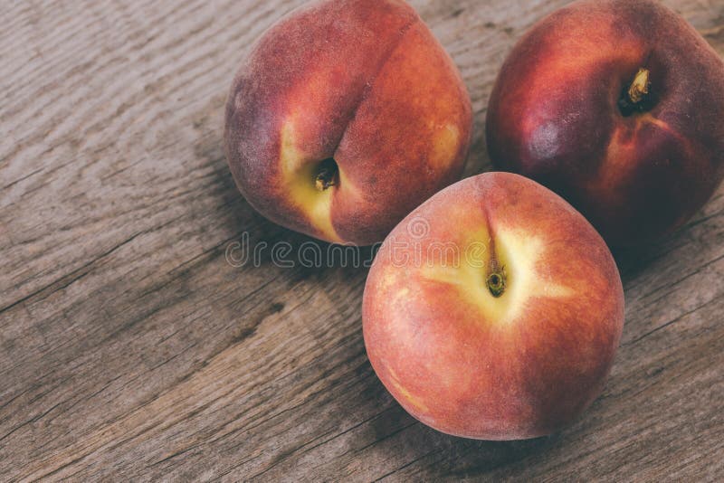Group of Three Peaches on Wooden Background Stock Image - Image of ...