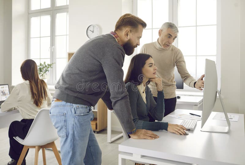 Team of Employees Using Computer, Working on Online Project and ...