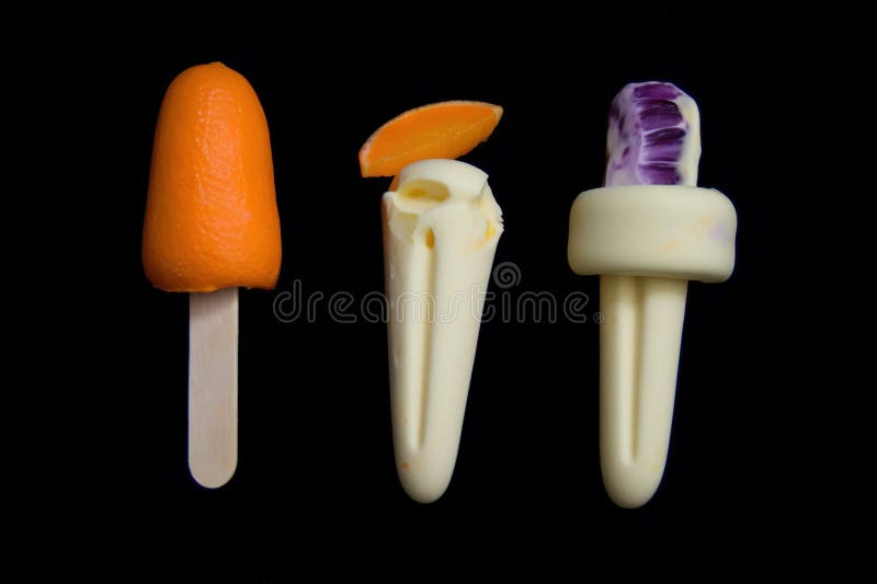 A Group of Three Pops with Different Types of Fruit on Them and a Slice ...