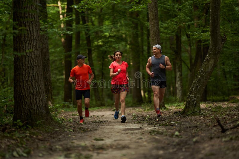 Group of people running stock photo. Image of grass - 285314668