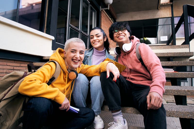 Group of Three Students Outside the School Looking at the Camera Stock ...