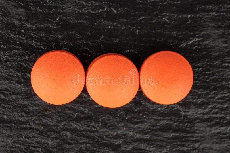Orange Pharmacy Tablet on Grey Stone Stock Photo - Image of intense ...