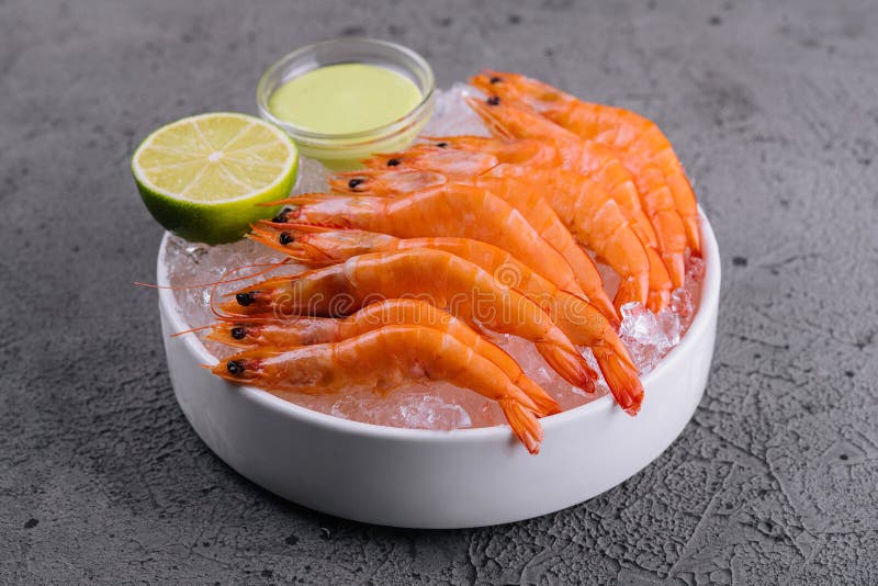 A Group of Tiger Shrimp on a Bowl of Ice with Lime Stock Image - Image ...