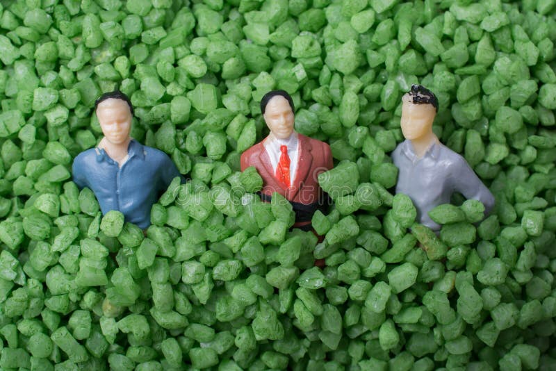 Group of Tiny Figurine of Men Model in Sand Stock Image - Image of ...