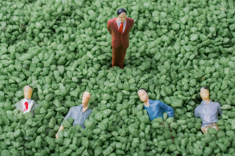 Group of Tiny Figurine of Men Model in Sand Stock Image - Image of ...