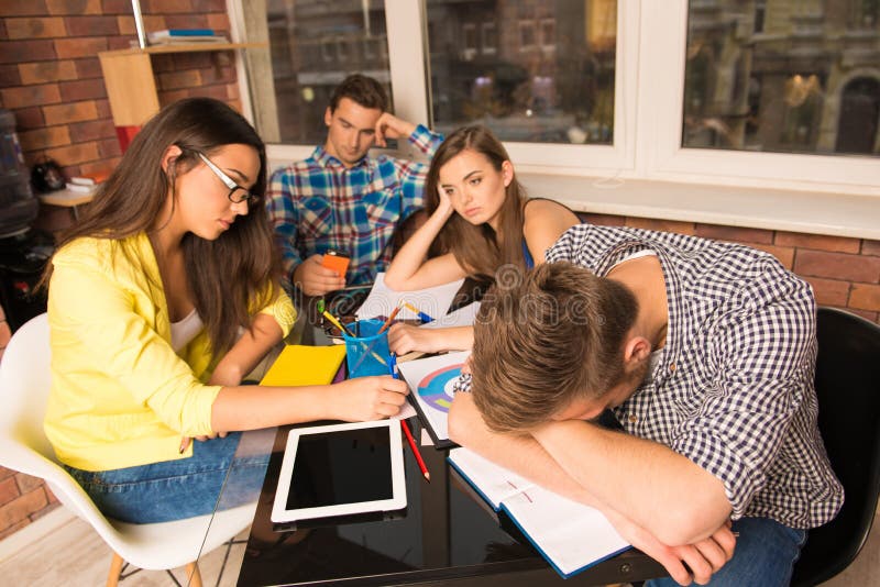Group of Tired Students Working Hard Together Stock Image - Image of ...