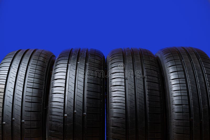 Group of Tires on a Blue Background Stock Image - Image of background ...